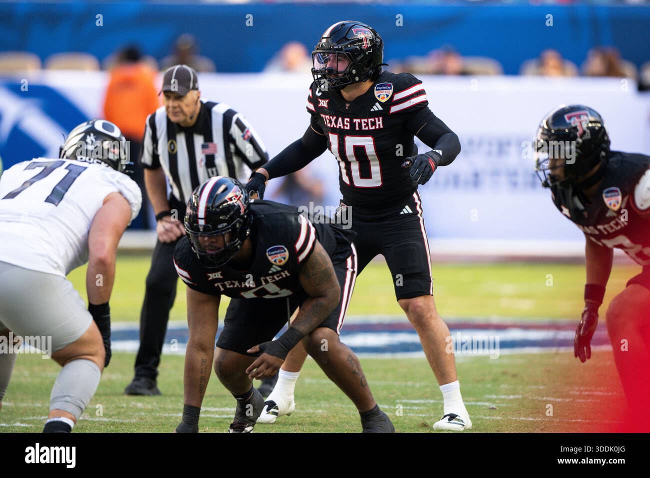 Texas Tech Red Raiders linebacker Jacob Rodriguez (10) sets at the line ...