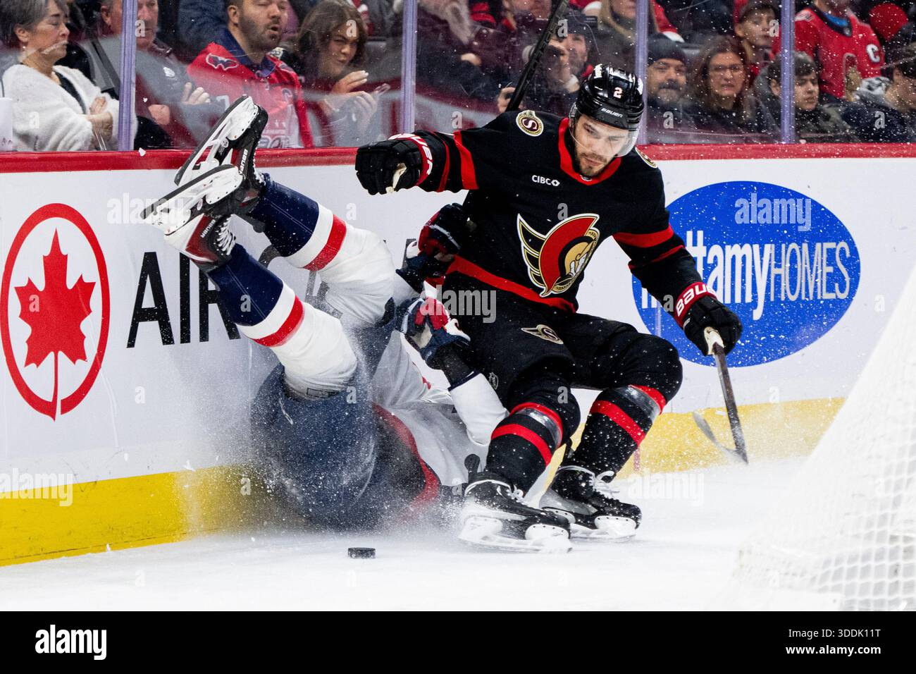 Washington Capitals' Aliaksei Protas (21) looses his edge as he crashes ...