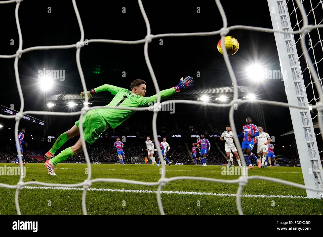 Fulham's Tom Cairney (rear, fourth left) shoots past Crystal Palace ...