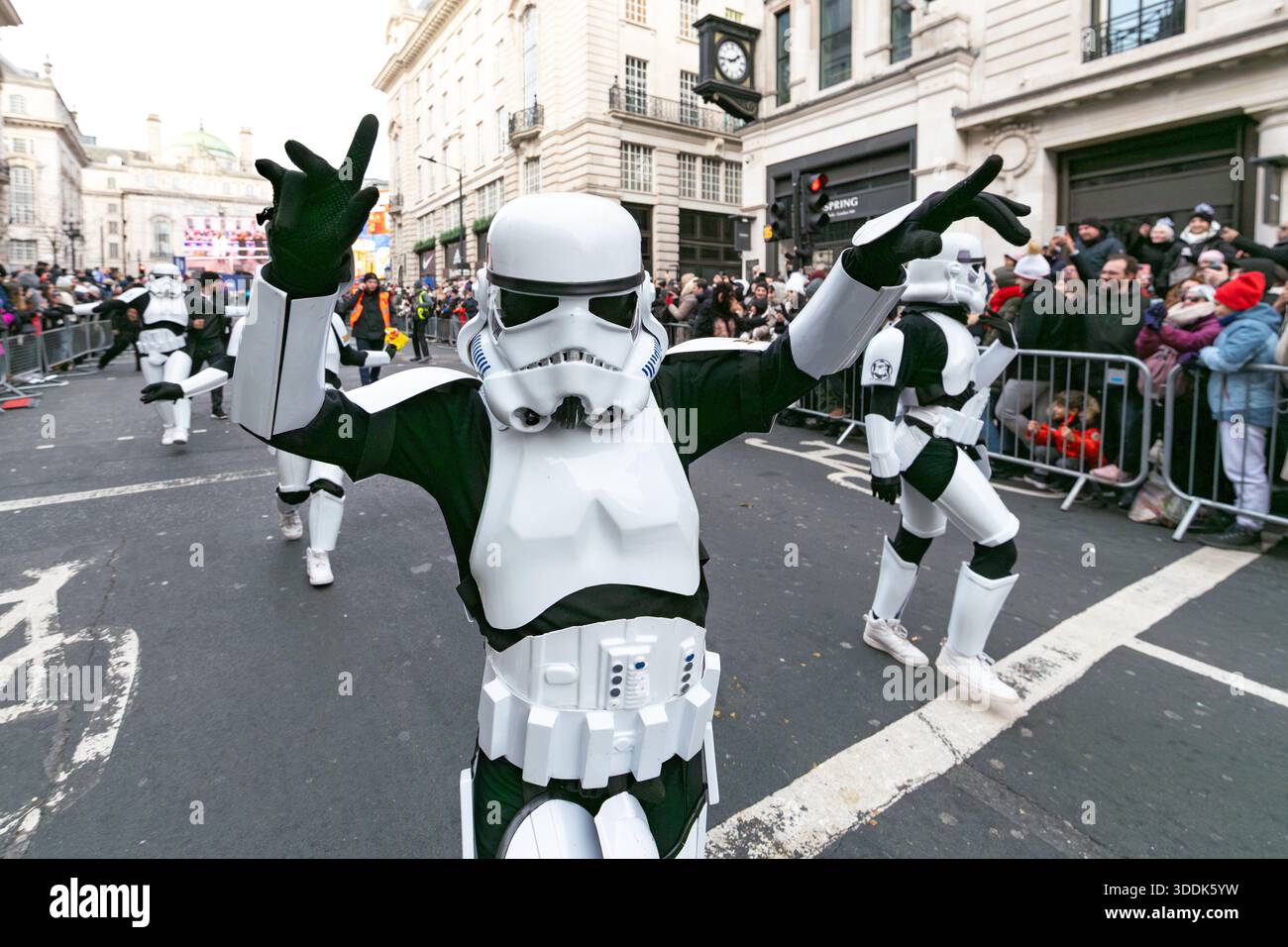 Performers in a stormtrooper costume parading. Performers, marching ...