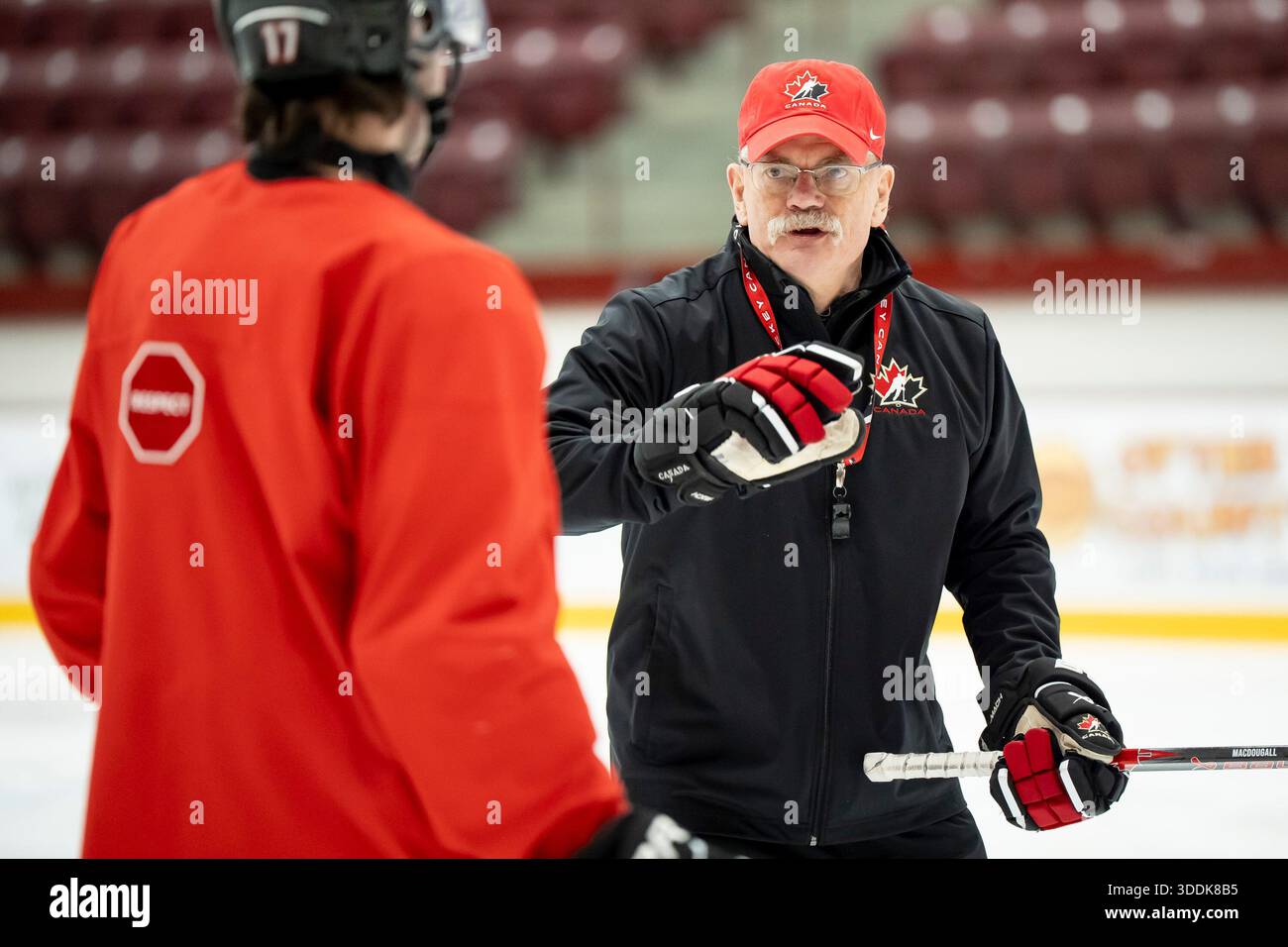 Team Canada assistant coach Gardiner MacDougall speaks to Canada's Jett ...