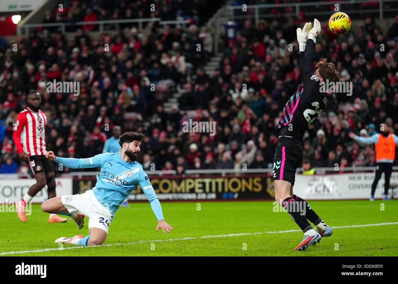 Manchester City's Josko Gvardiol has a shot on goal saved by Sunderland ...