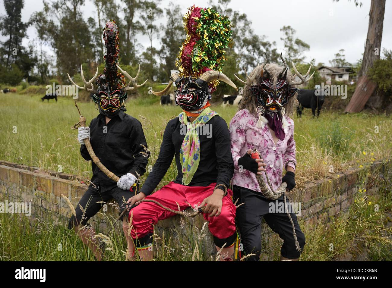 Revelers wearing devil masks pose for a photo before taking part in ...