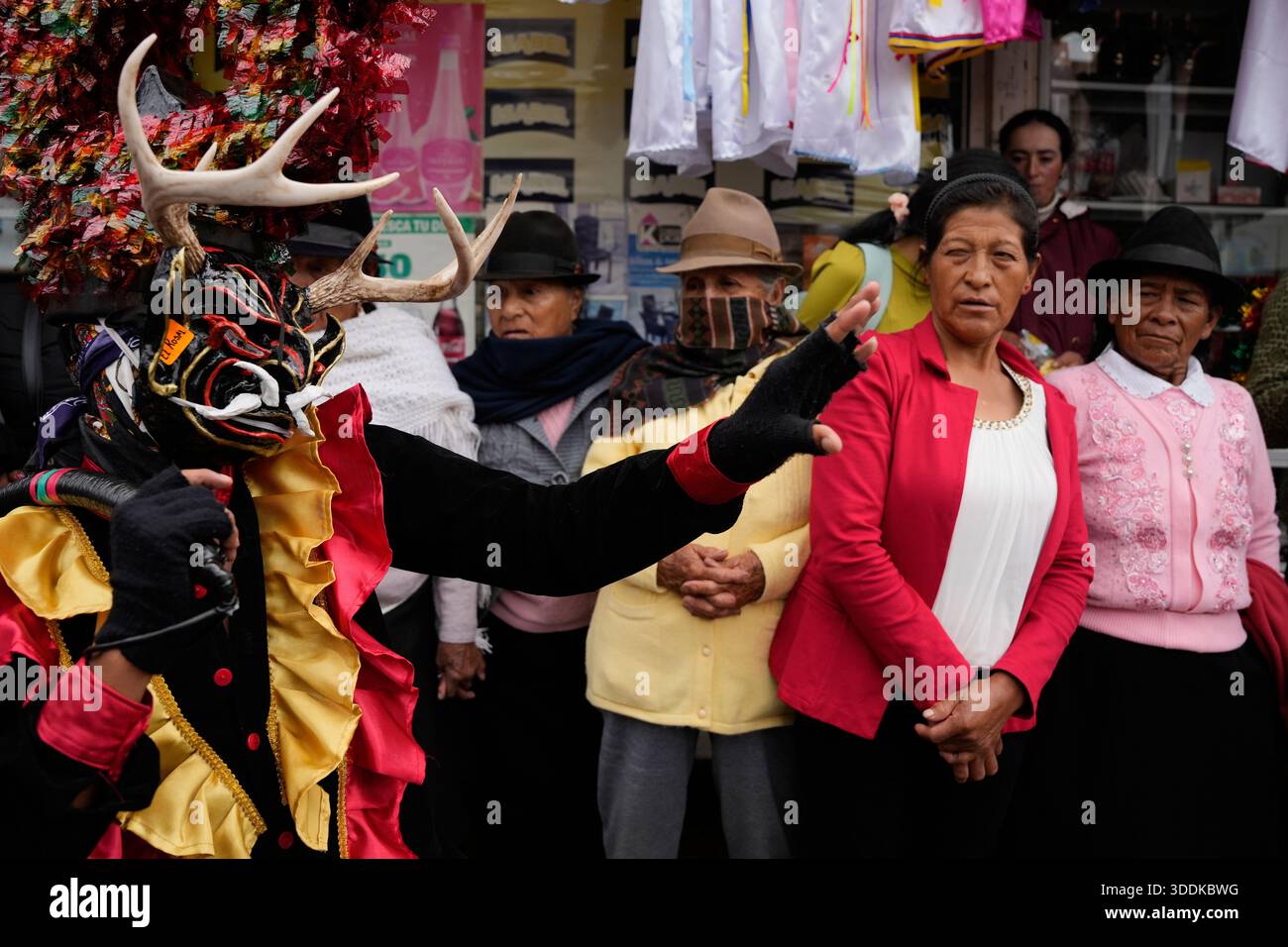 Residents watch revelers in devil masks during traditional New Year's ...