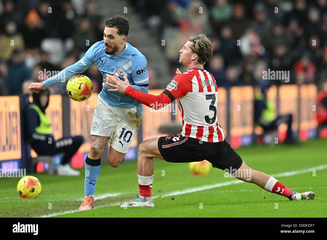Sunderland's Dennis Cirkin tackles Manchester City's Rayan Cherki ...