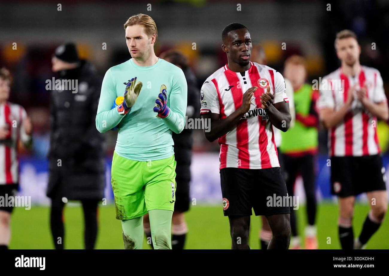 Brentford goalkeeper Caoimhin Kelleher (left) and Michael Kayode ...