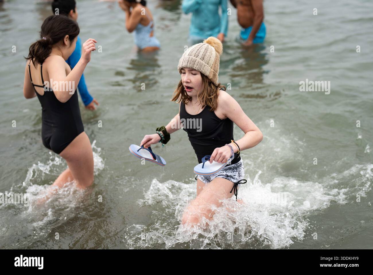 A person exits the water during the Polar Bear Swim in Vancouver, on ...