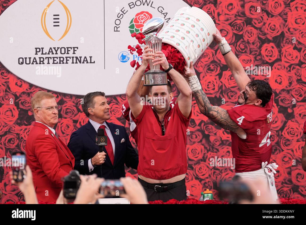 Indiana head coach Curt Cignetti holds the winner's trophy after a win ...