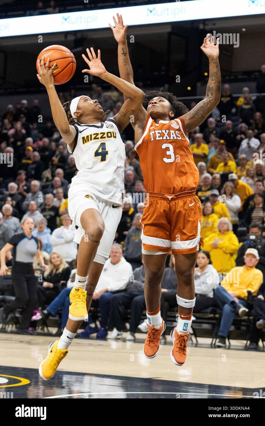 Missouri's Lisa Thompson (4) shoots over Texas' Rori Harmon (3) during ...