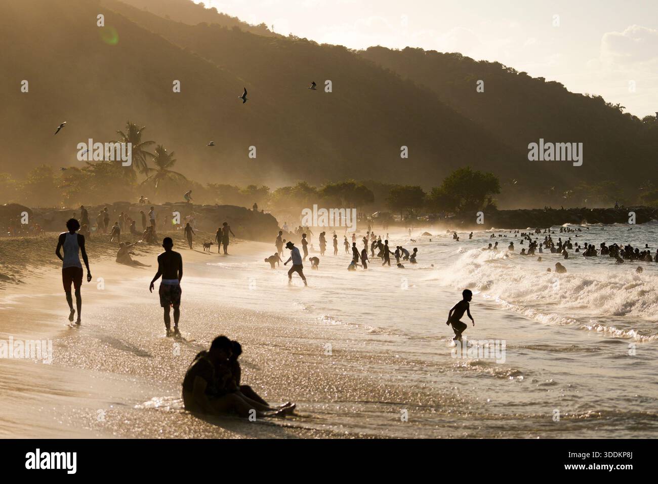 People gather on the shore of a beach in La Guaira, Venezuela, Thursday ...