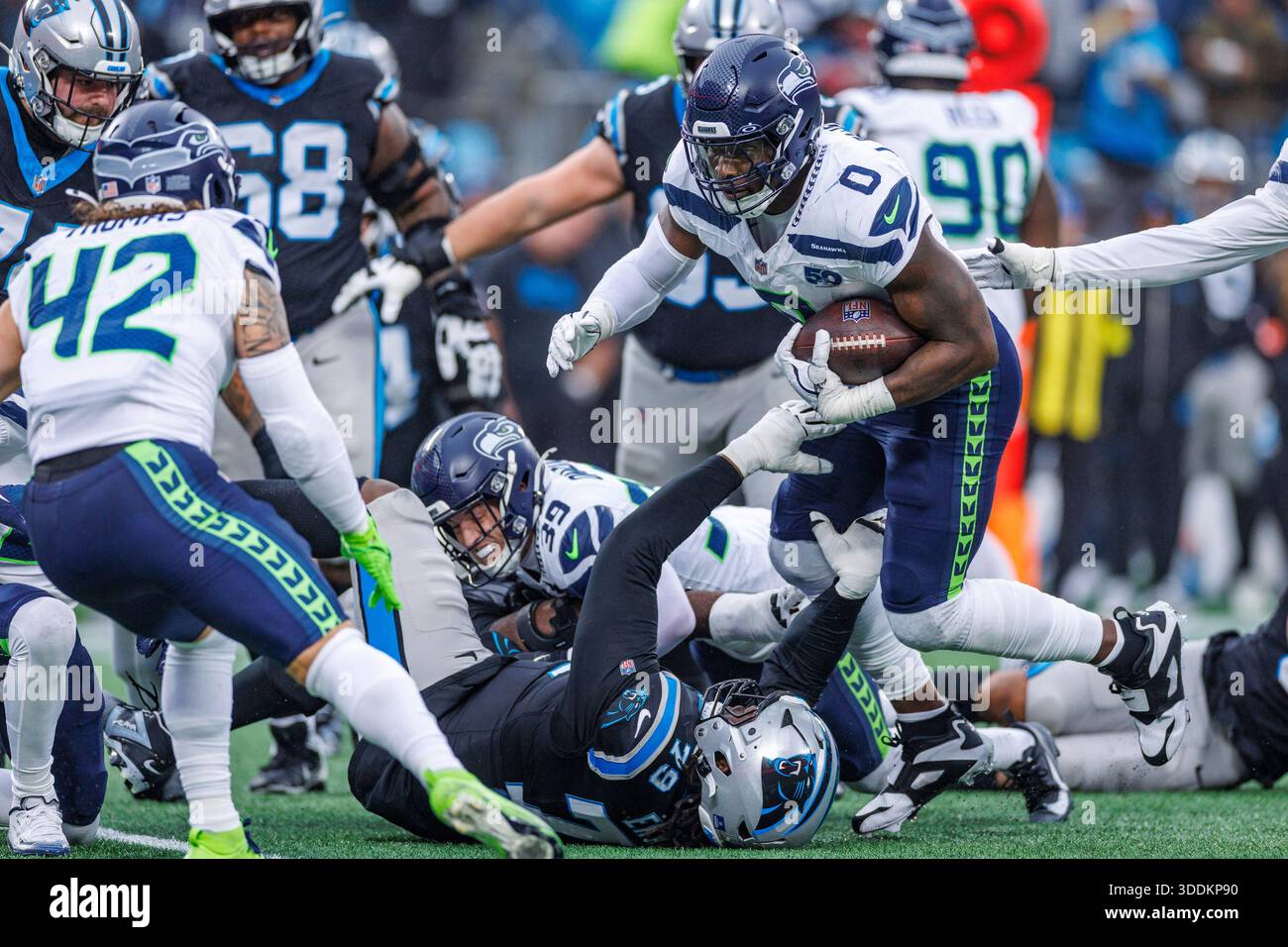 Seattle Seahawks linebacker Demarcus Lawrence (0) attempts to return a ...