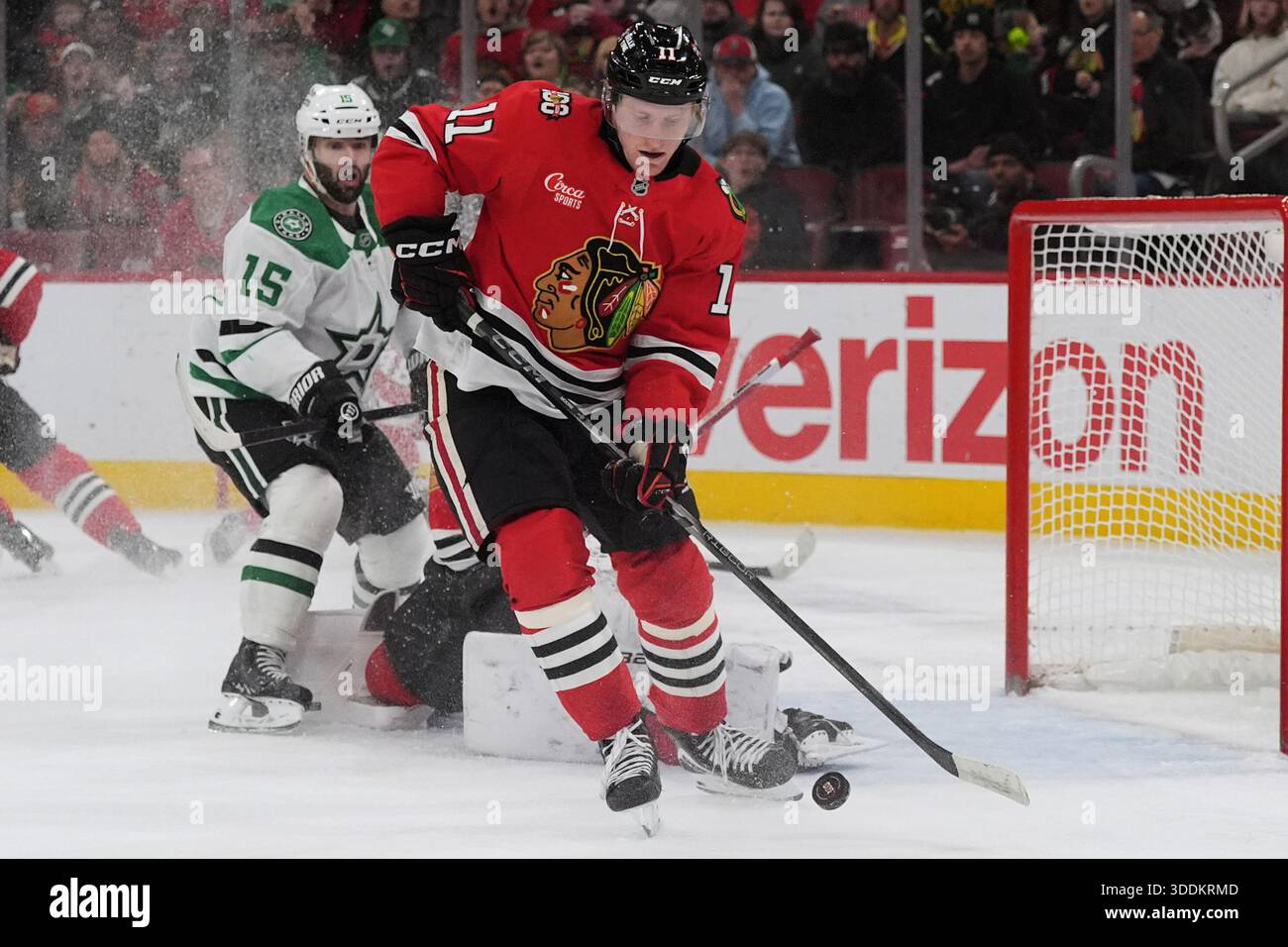 Chicago Blackhawks center Oliver Moore controls the puck past Dallas ...