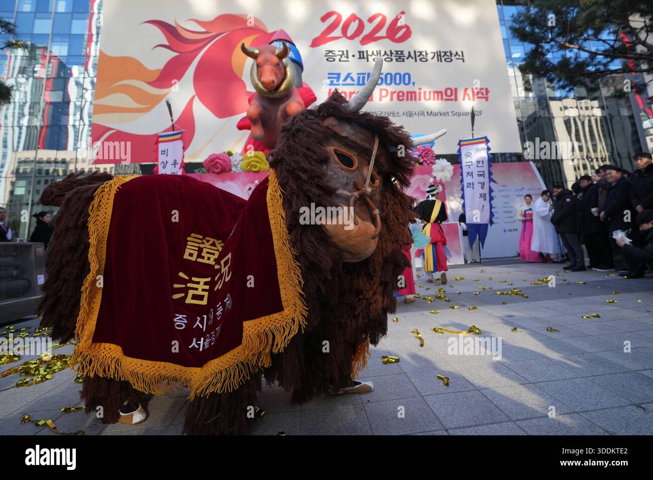 Dancers in a bull-shaped costume perform to celebrate the opening for ...