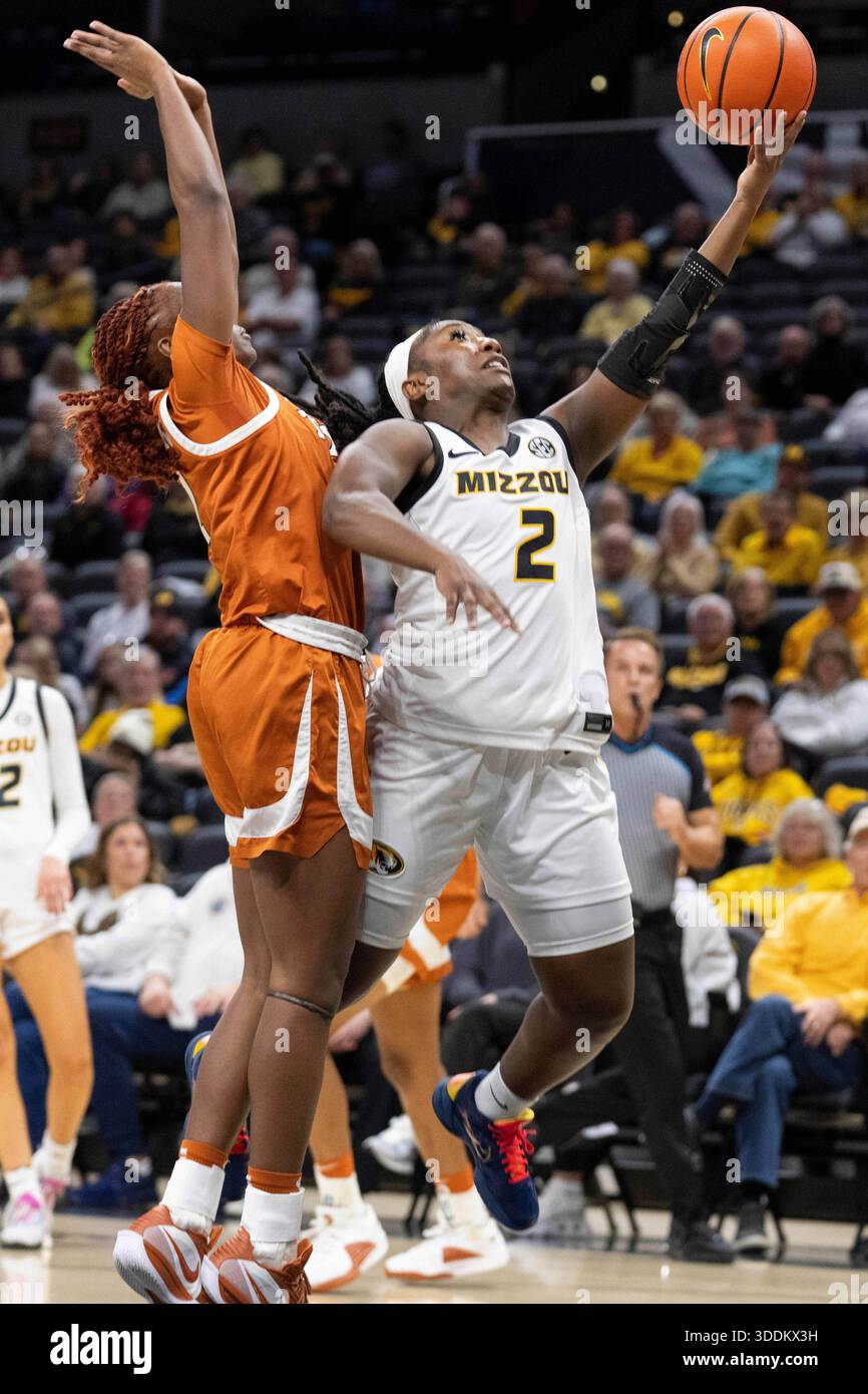 Missouri's Saniah Tyler (2) shoots past Texas' Lisa Thompson during the ...