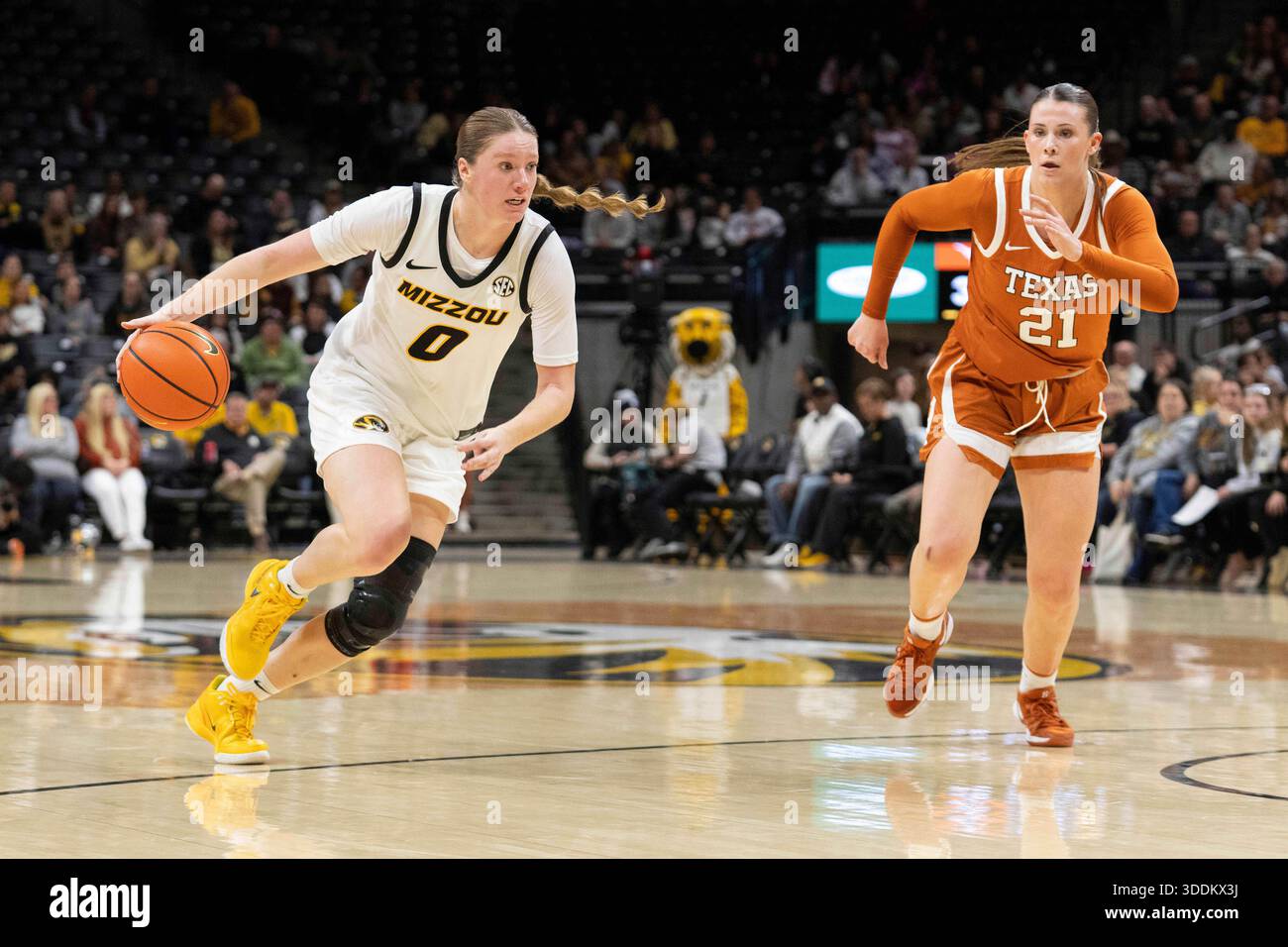 Missouri's Grace Slaughter (0) drives past Texas' Ashton Judd (21 ...