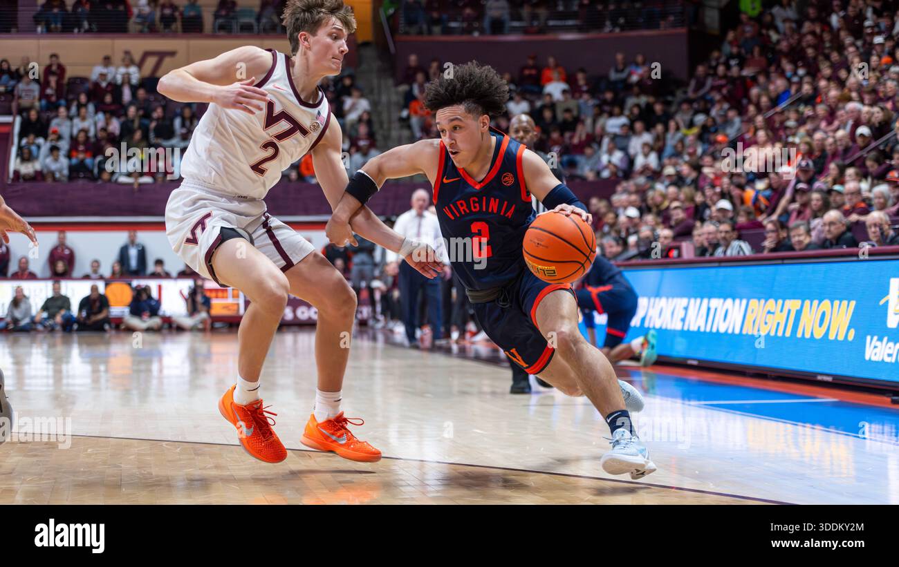 Virginia guard Chance Mallory (2) dribbles by Virginia Tech guard Jaden ...