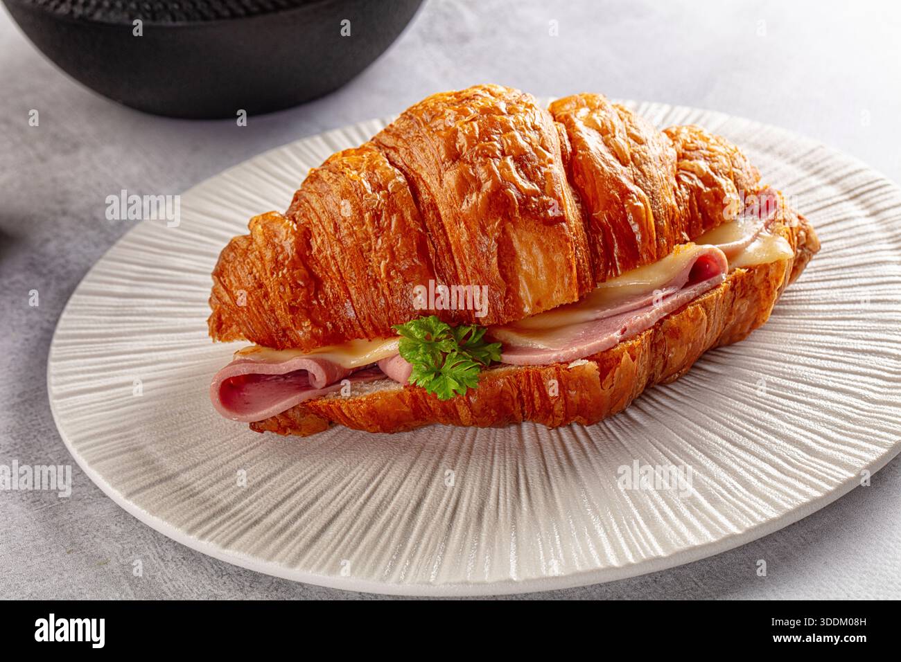 Crunch croissant with ham and cheese Stock Photo - Alamy