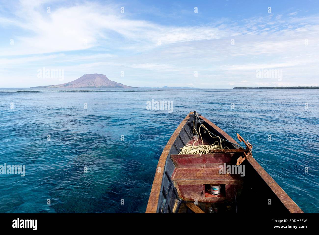 Dangerous Ruang island with A-type cone volcano, that rises from the ...
