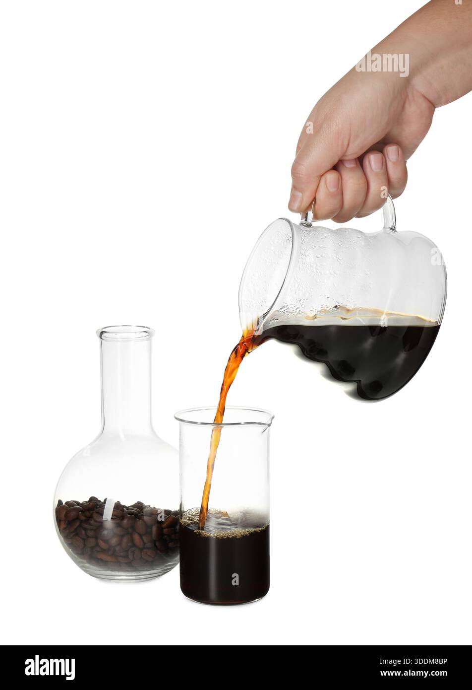 Woman pouring coffee into beaker on white background, closeup Stock ...