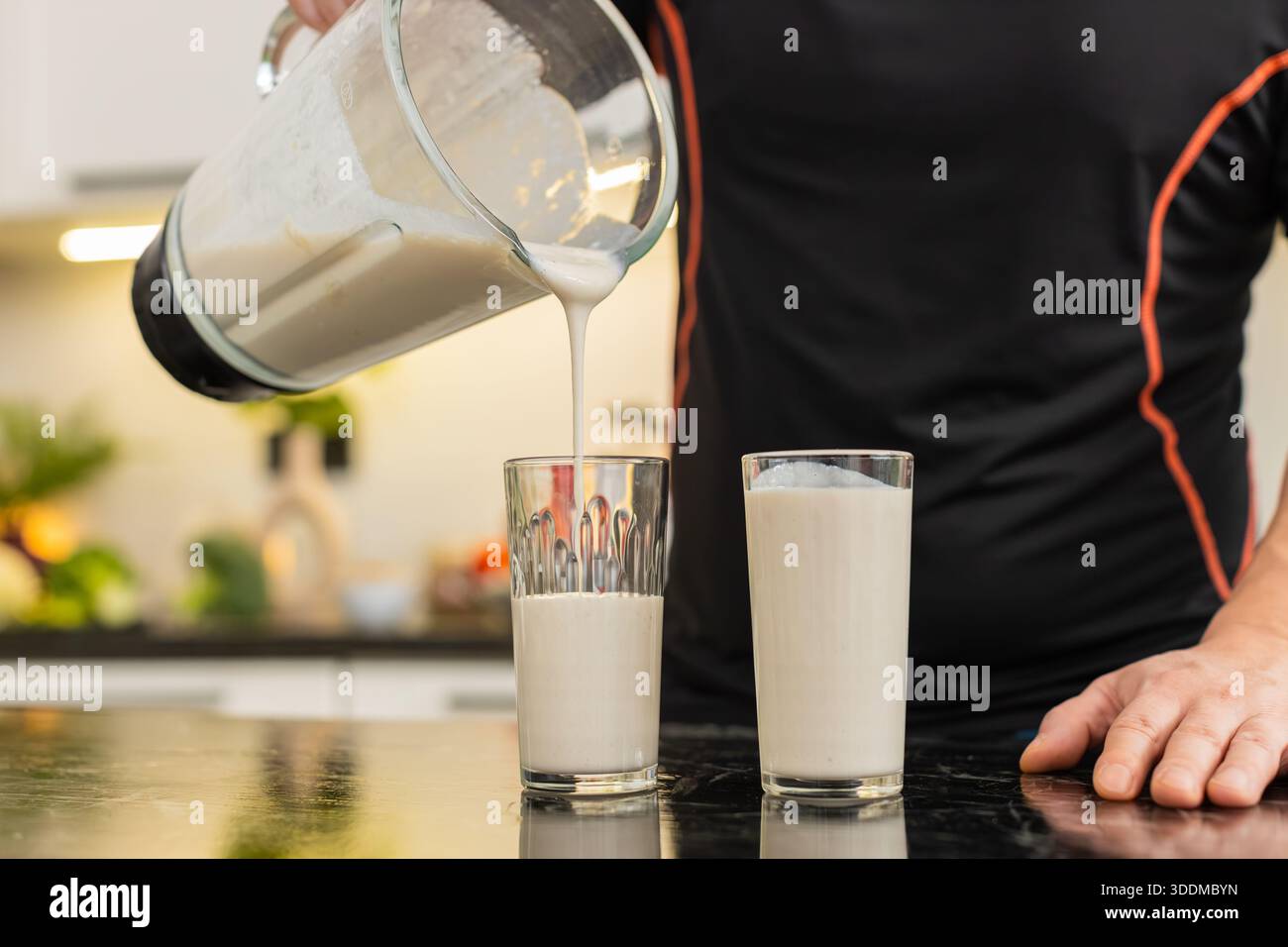 Man pours protein smoothie from hi-res stock photography and images - Alamy