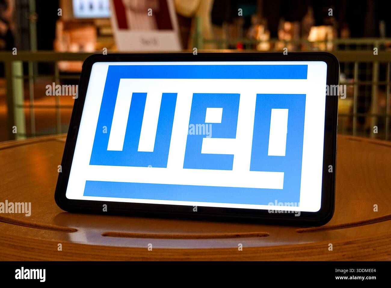 In this photo illustration, the logo of WEG is displayed on the screen ...