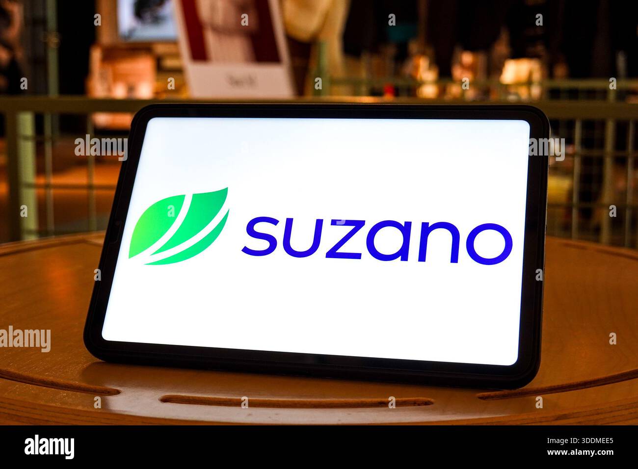 In this photo illustration, the logo of Suzano is displayed on the ...