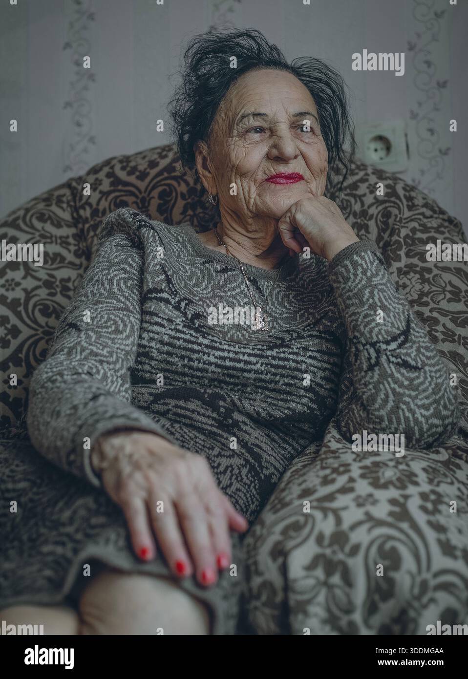Mature woman sits thoughtfully hi-res stock photography and images - Alamy