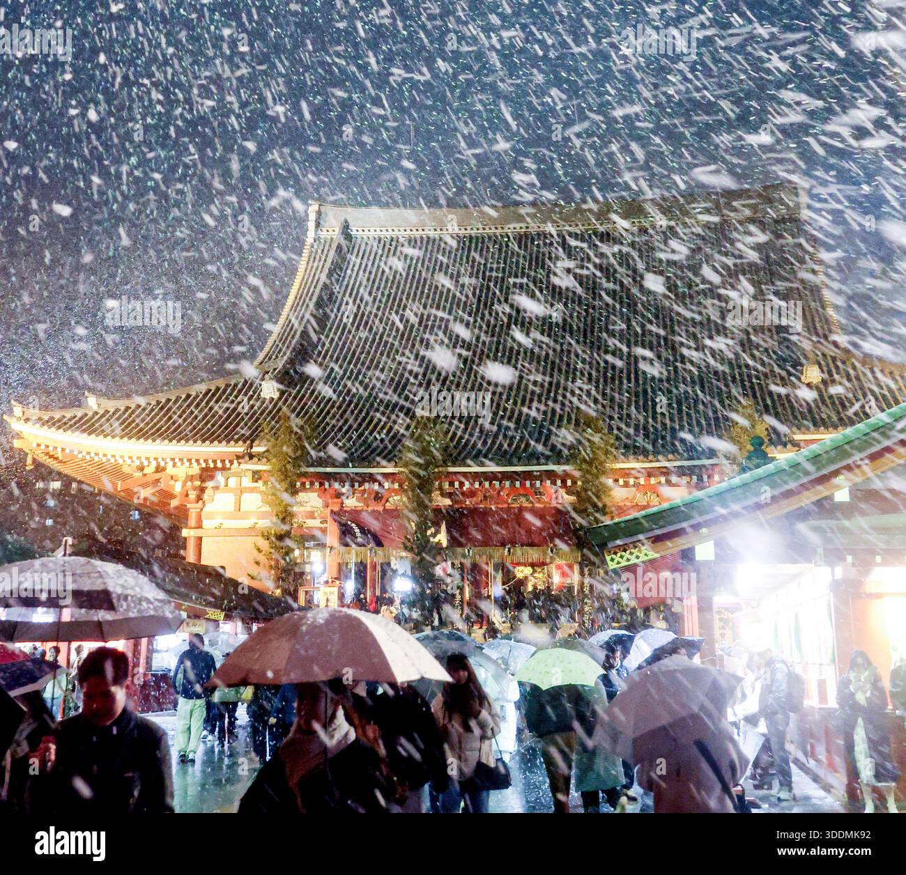 Snow falls in Taito Ward, Tokyo, on January 2, 2026. Worshippers visit ...