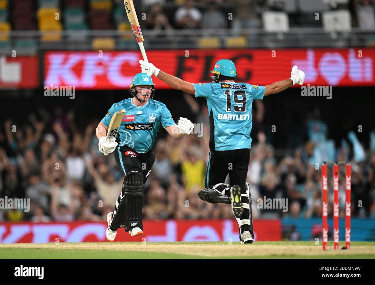 Max Bryant (left) of the Heat celebrates hitting the winning runs with ...