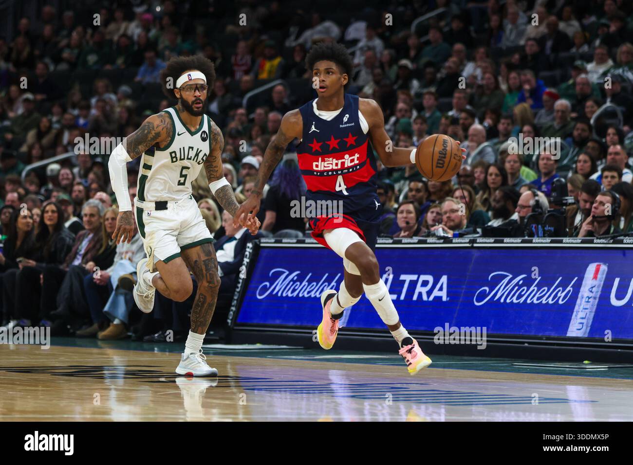 Washington Wizards' AJ Johnson brings the ball up the court past ...