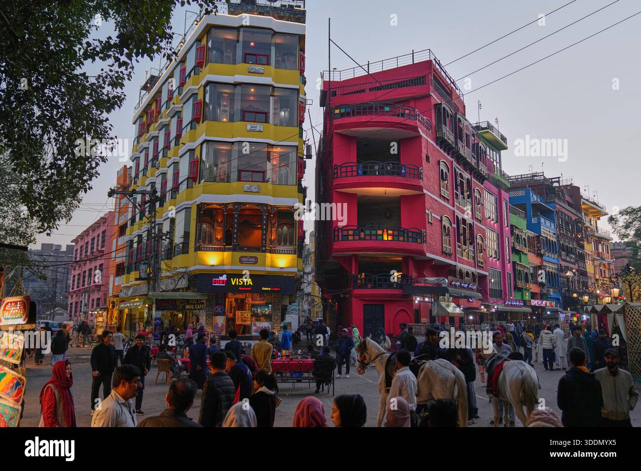 People walk past heritage buildings, which convert in a modern ...