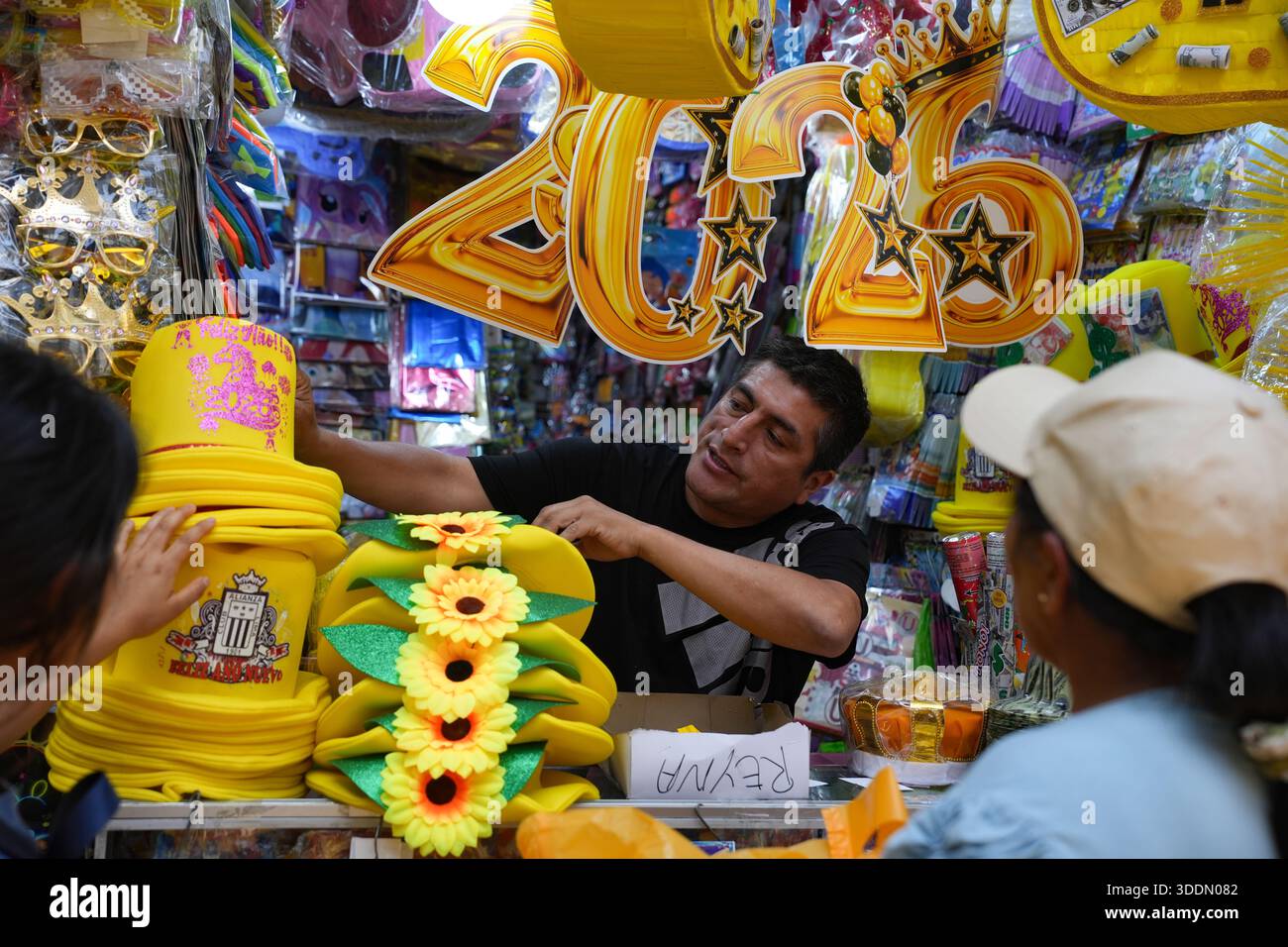 FILE - A vendor sells New Year's eve party goods at a market in ...