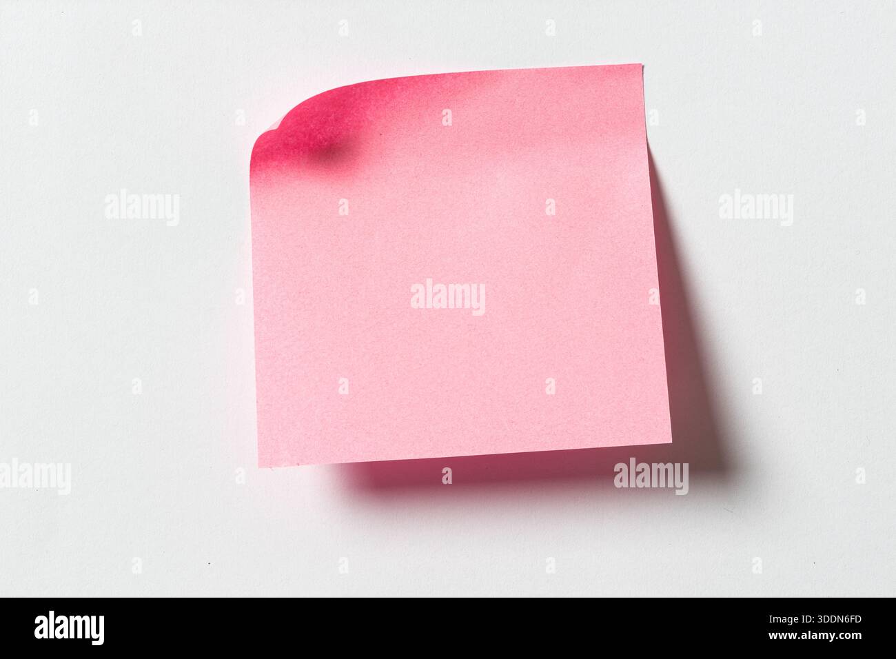 Blank pink sticky note on white wall. Template mock up Stock Photo - Alamy