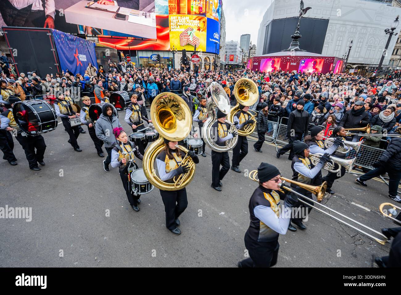 London, UK. 1 Jan 2026. Evans High School band passing the piccadilly ...