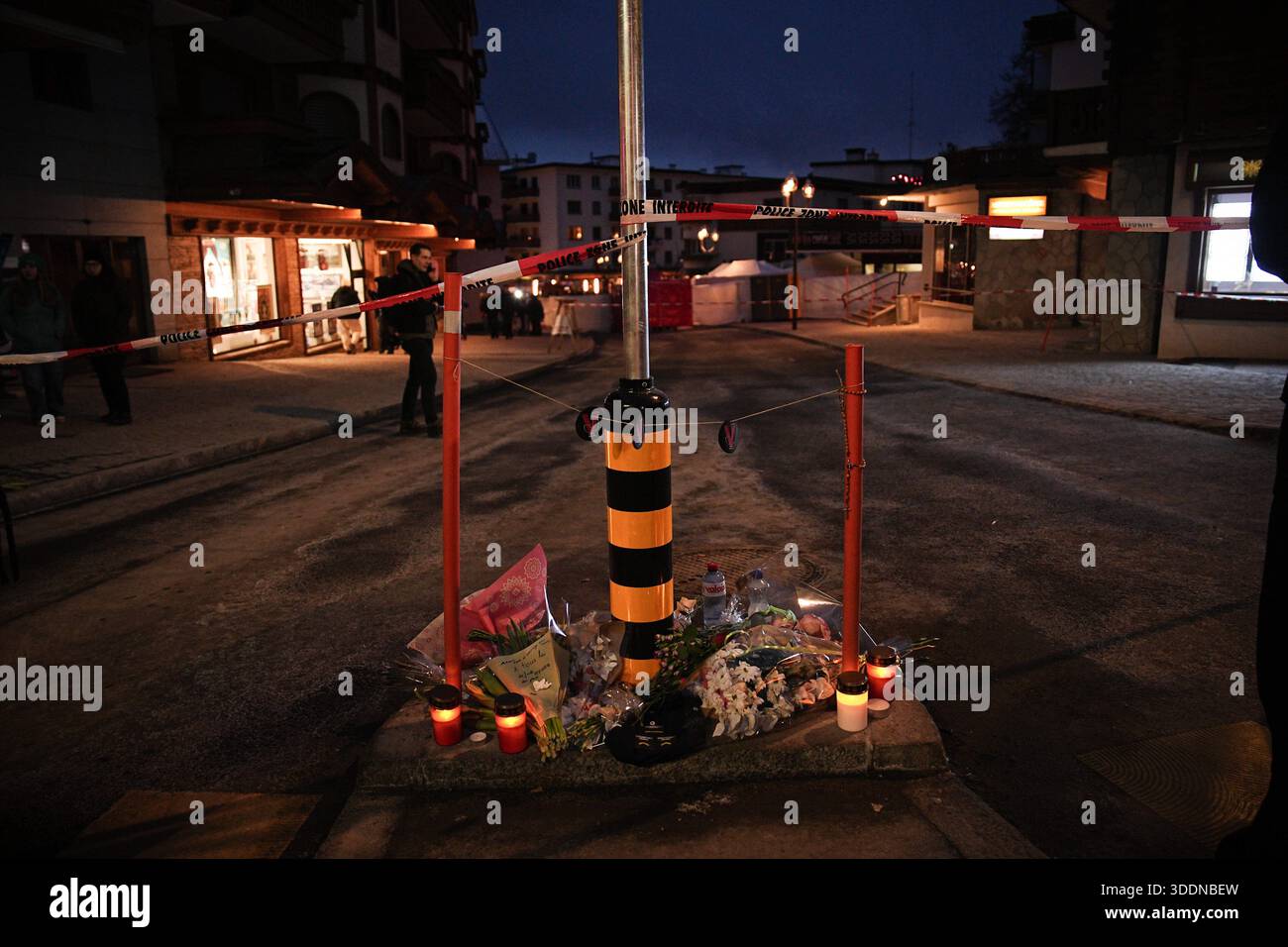 People lay flowers and candles near the Le Constellation bar, where a ...