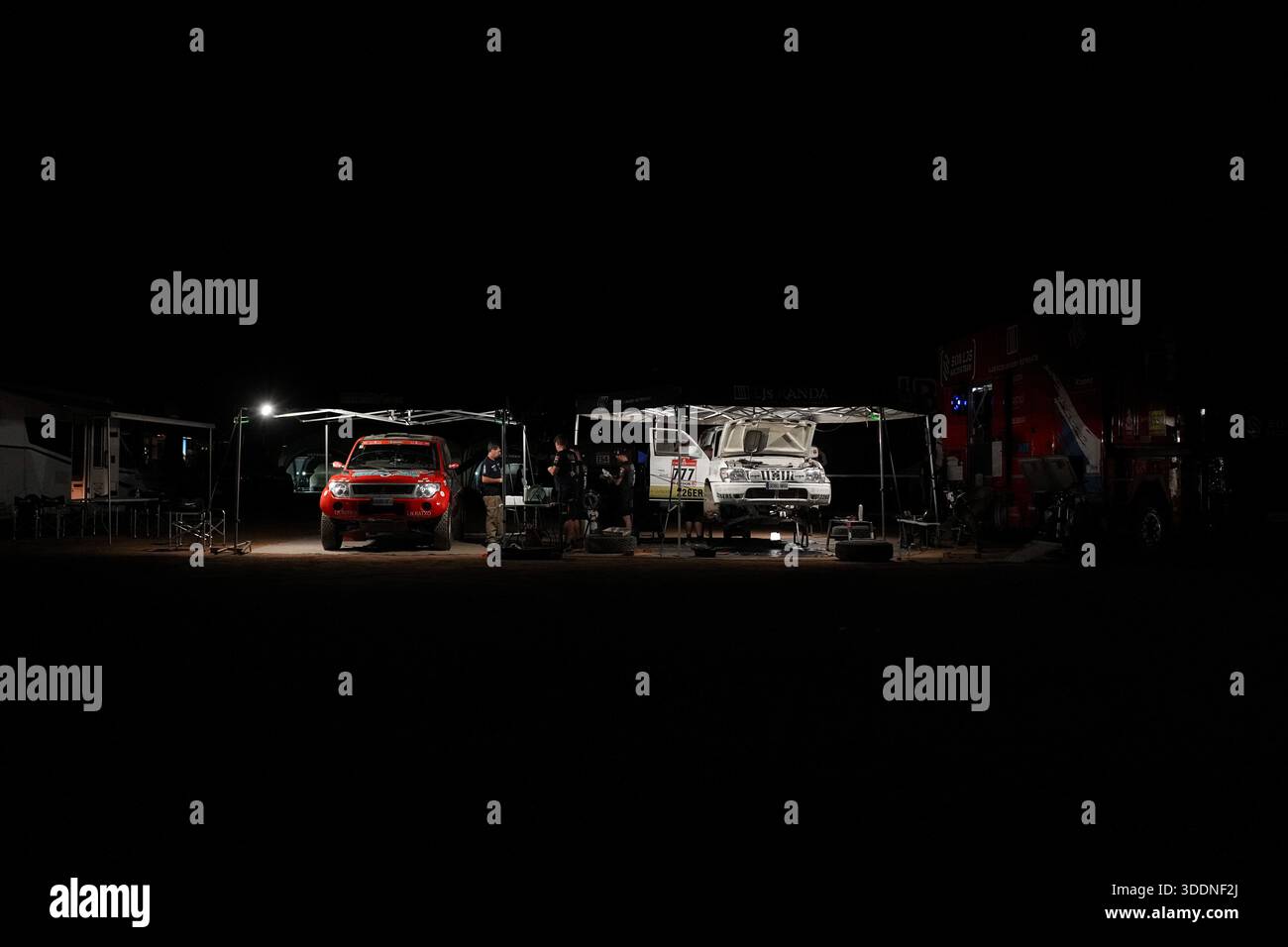 Mechanics prepare cars ahead of the Dakar Rally in Yanbu, Saudi Arabia ...