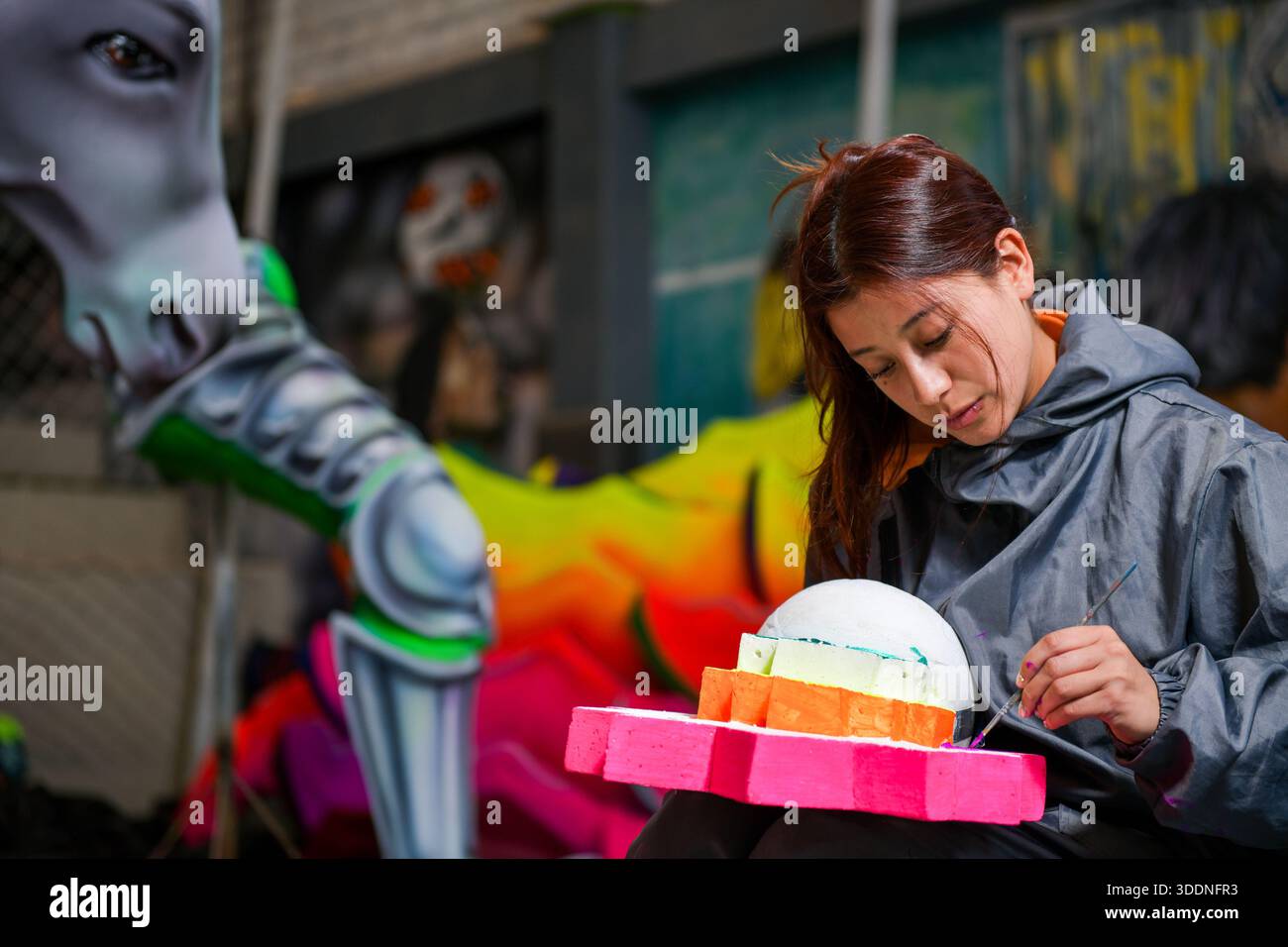 Master artisan Daniela Salazar works on the float “Encanto”, set to ...