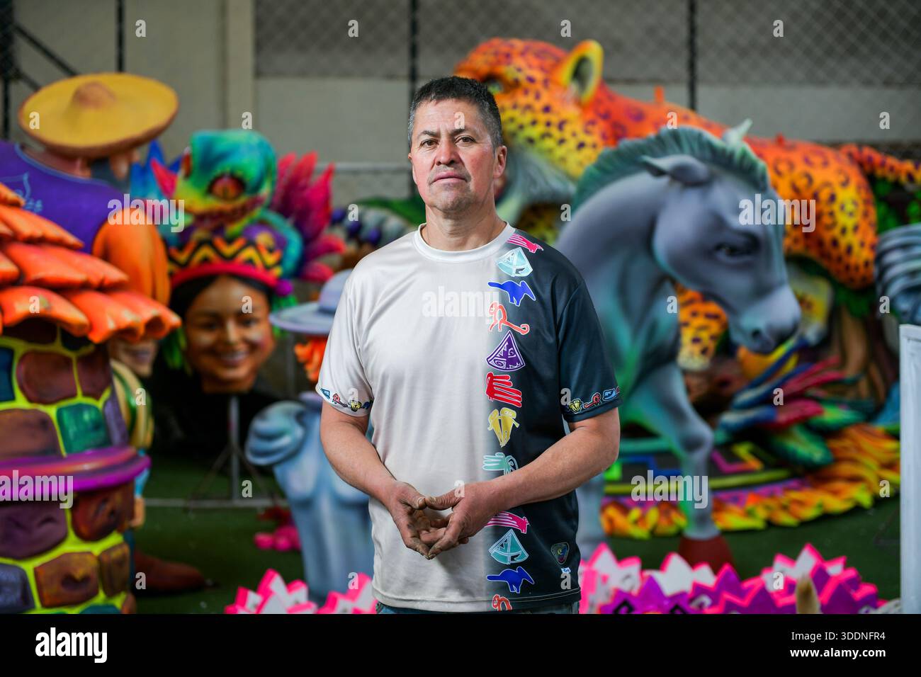 Master artisan Miguel Mejia works on the float “Encanto”, set to parade ...