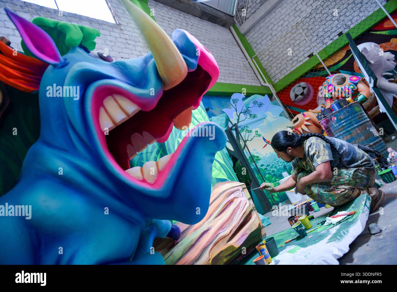 Master artisan Alvaro Cordoba works on the float “Encanto”, set to ...