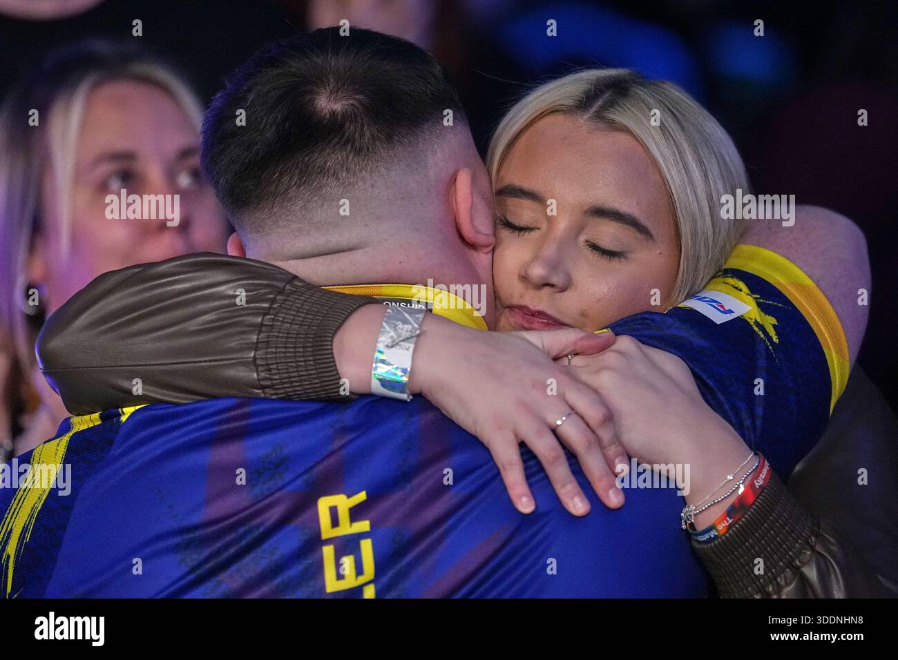 England's Luke Littler hugs his girlfriend Faith Millar before the ...