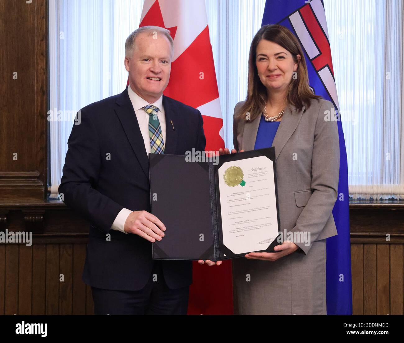 Alberta MLA Grant Hunter, left, poses with Alberta Premier Danielle ...