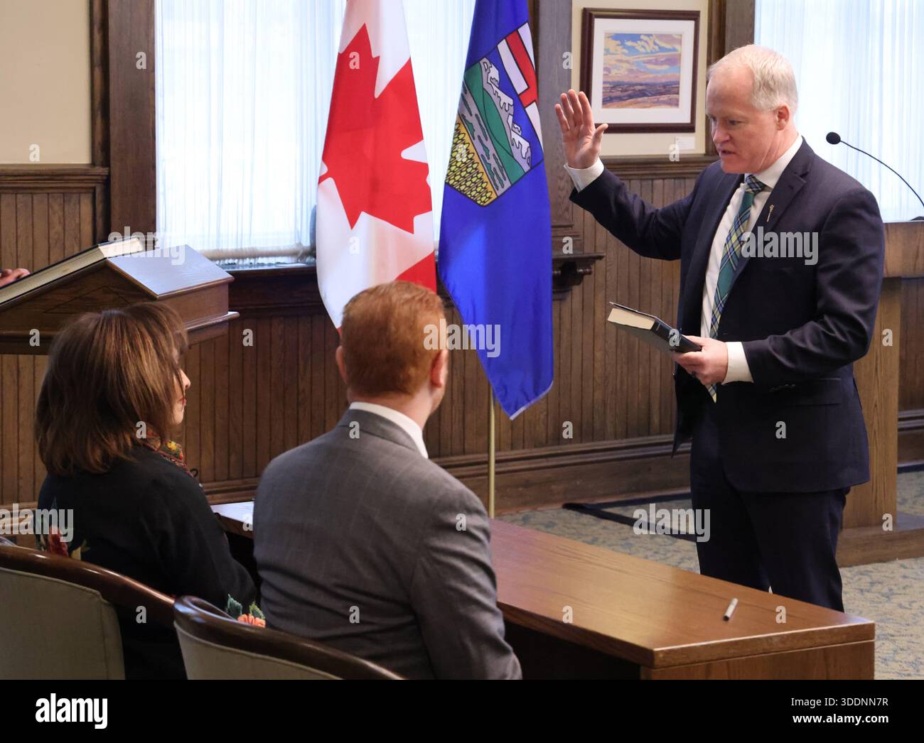 Alberta Lt.-Gov. Salma Lakhani, left, swears-in MLA Grant Hunter as the ...