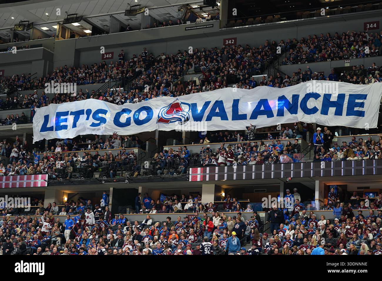 Sign hangs form the top level of seating in Ball Arena before the third ...