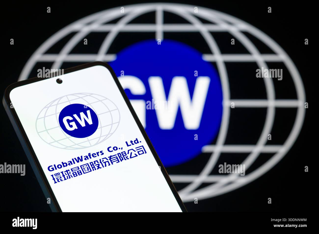 The GlobalWafers logo is being displayed on a mobile phone with the ...