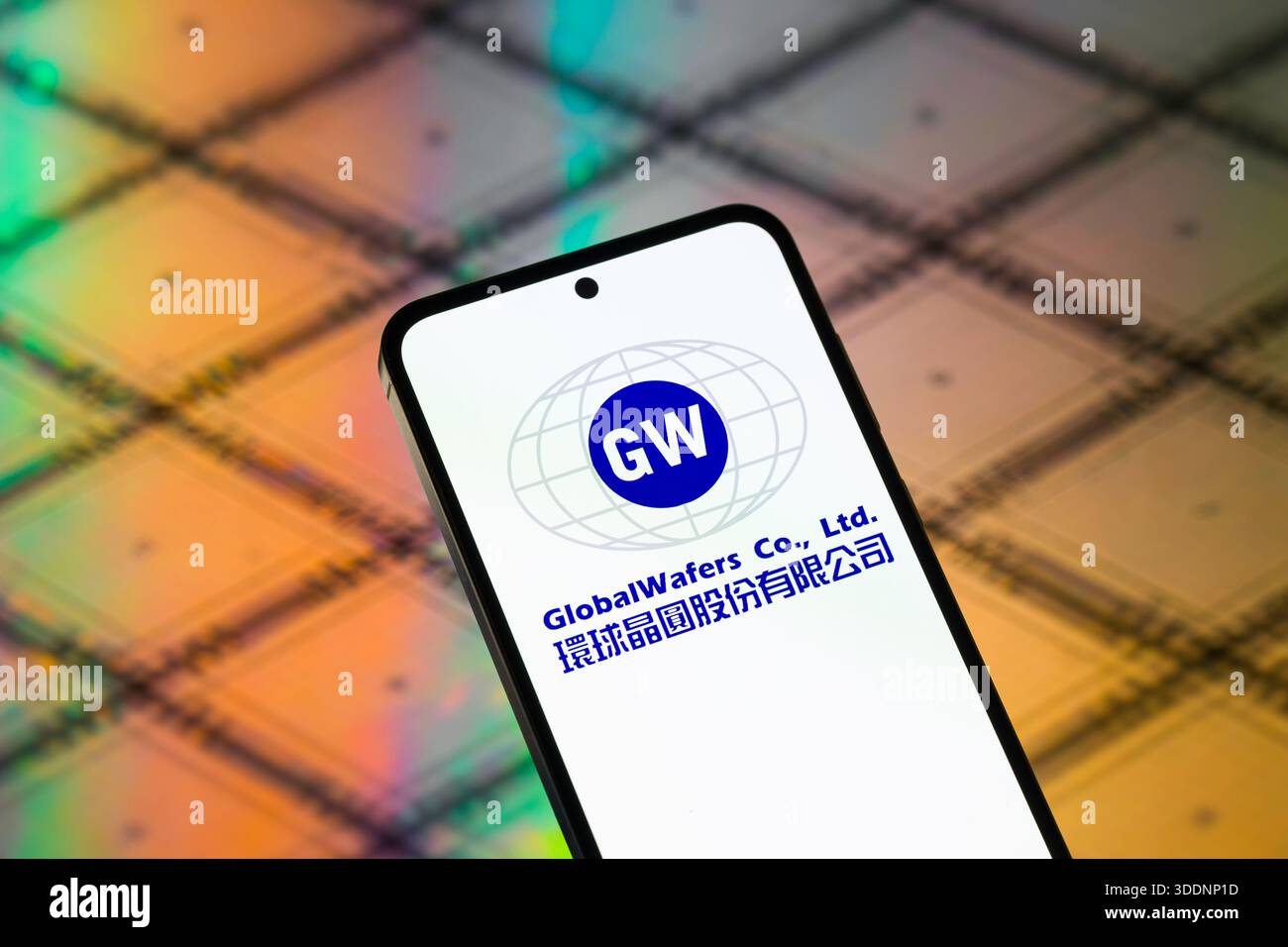 The GlobalWafers logo is being displayed on a mobile phone with a ...
