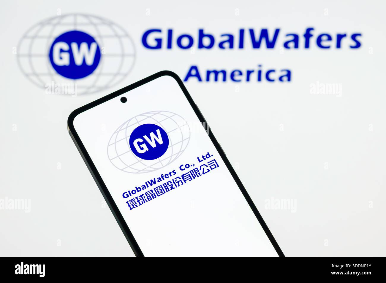The GlobalWafers logo is being displayed on a mobile phone with the ...