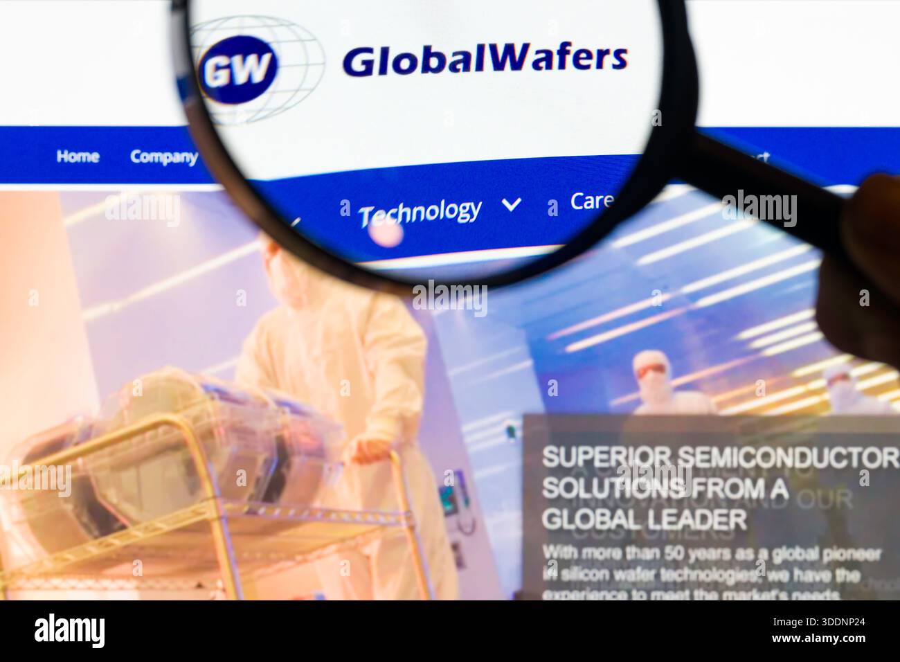 The GlobalWafers logo is pictured through a magnifying glass, in this ...
