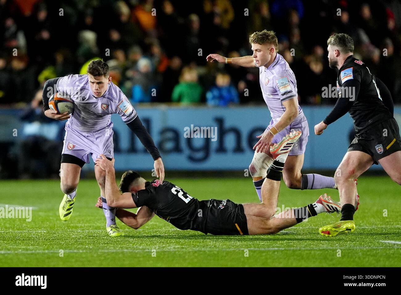 Gloucester's Seb Atkinson is tackled by Newcastle's Oliver Spencer ...