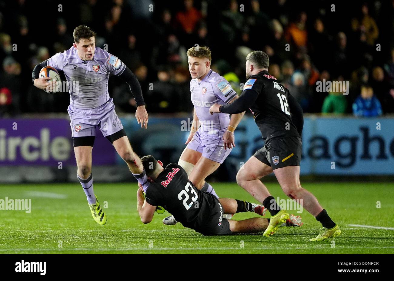 Gloucester's Seb Atkinson is tackled by Newcastle's Oliver Spencer ...