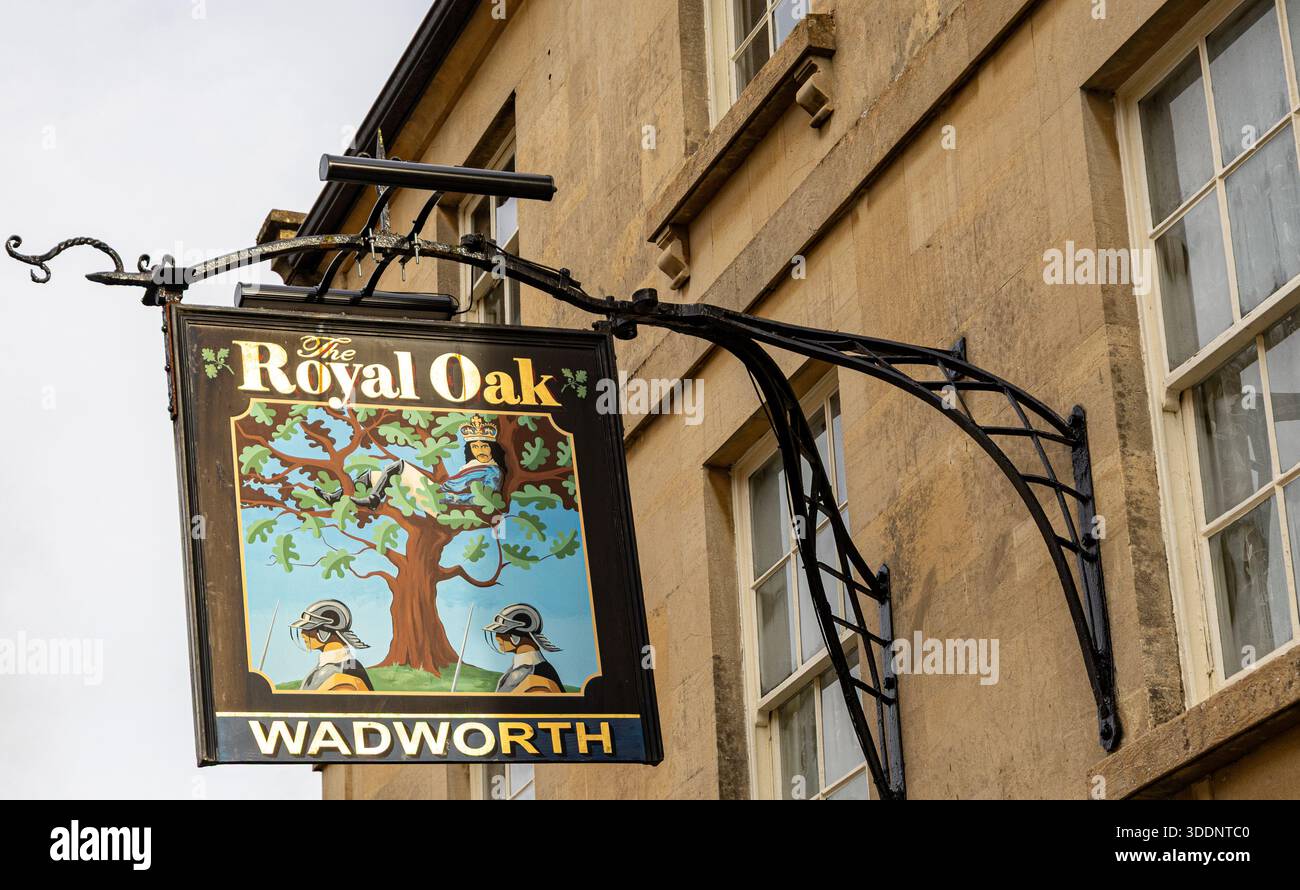 Traditional British pub sign for The Royal Oak mounted on a historic ...